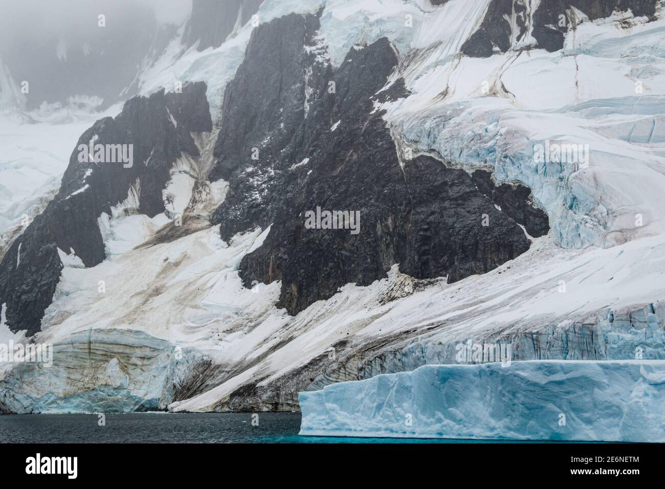Iceberg, glacier and mountain at Port Charcot, Antarctica Stock Photo ...