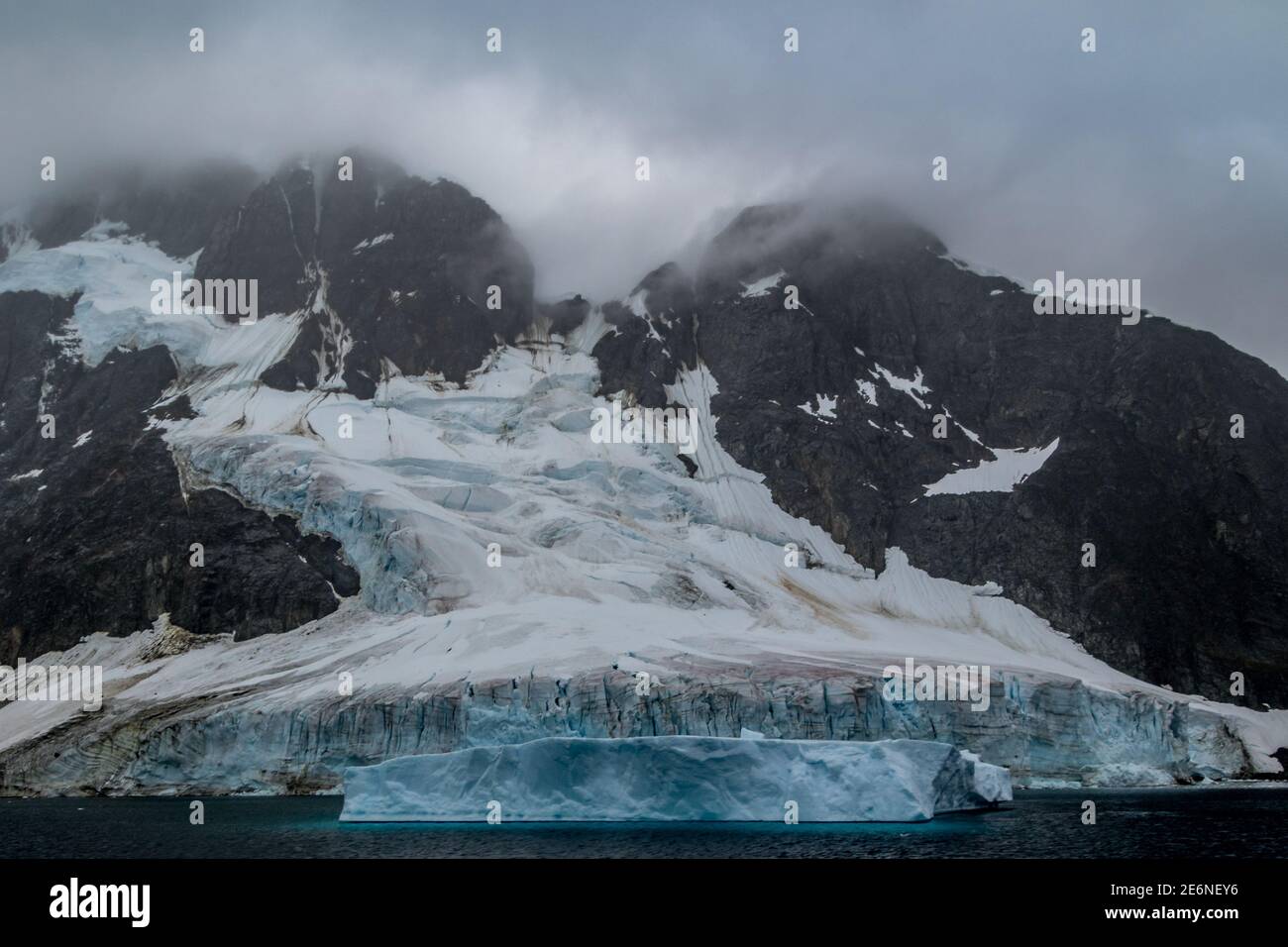 Iceberg, glacier and mountain at Port Charcot, Antarctica Stock Photo ...