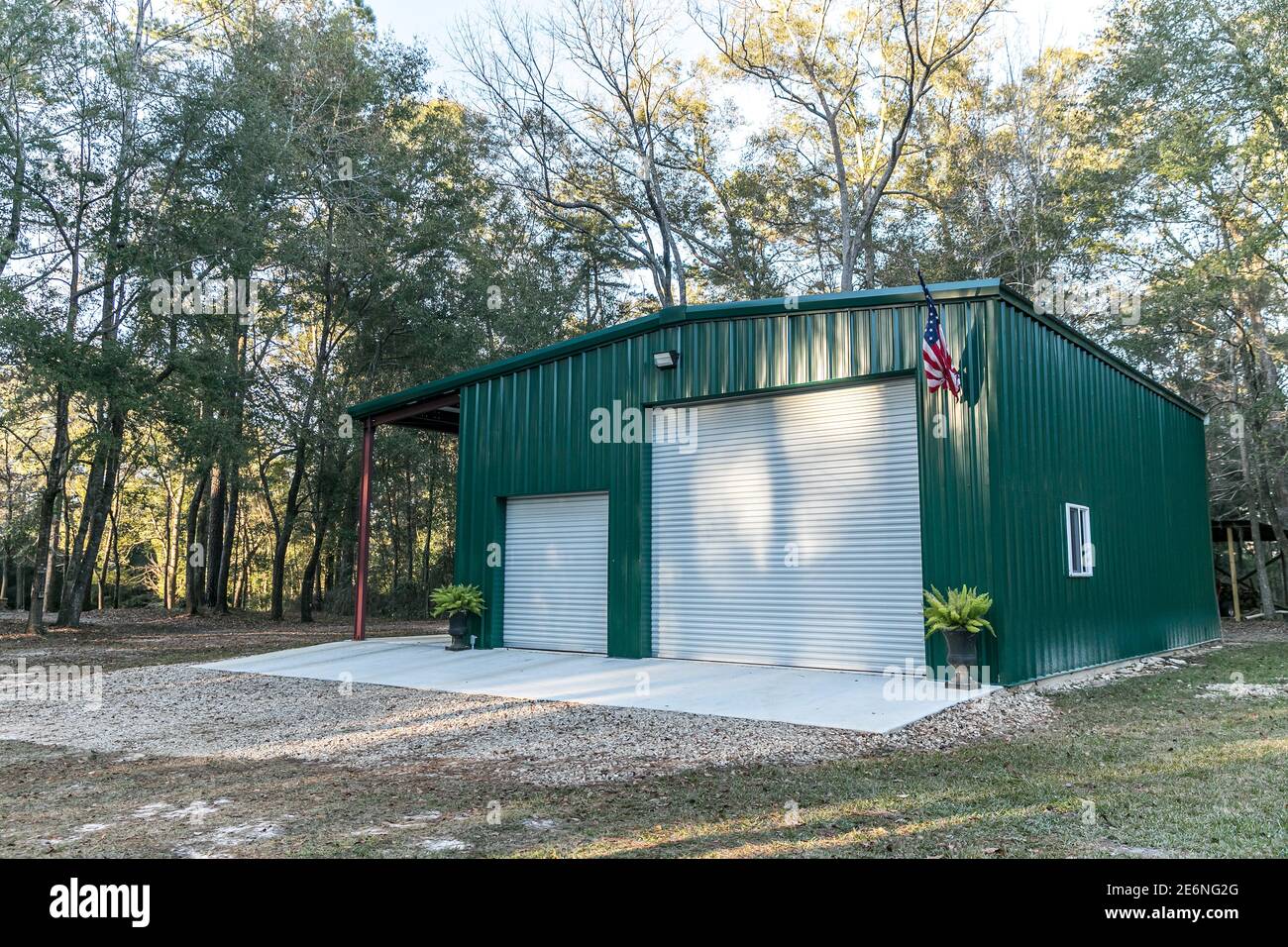 Large green outdoor metal building Stock Photo - Alamy