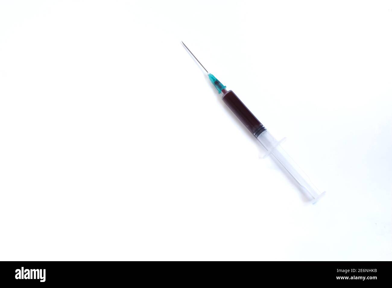 Medical syringe with blood inside isolated on white background with ...