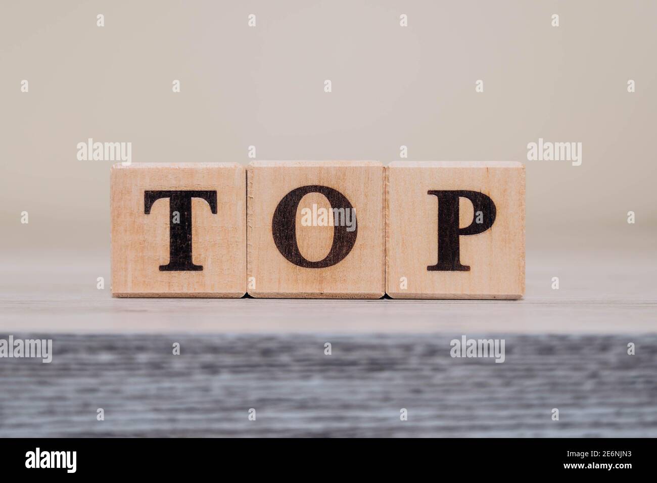 Word TOP on wooden cubes over bright background with copy space ...