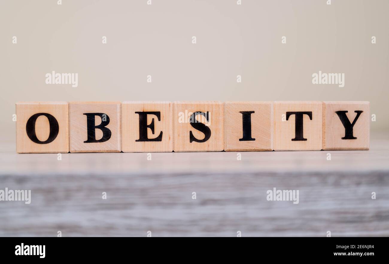 Word OBESITY on wood blocks. OBESITY letter text written on wood blocks ...