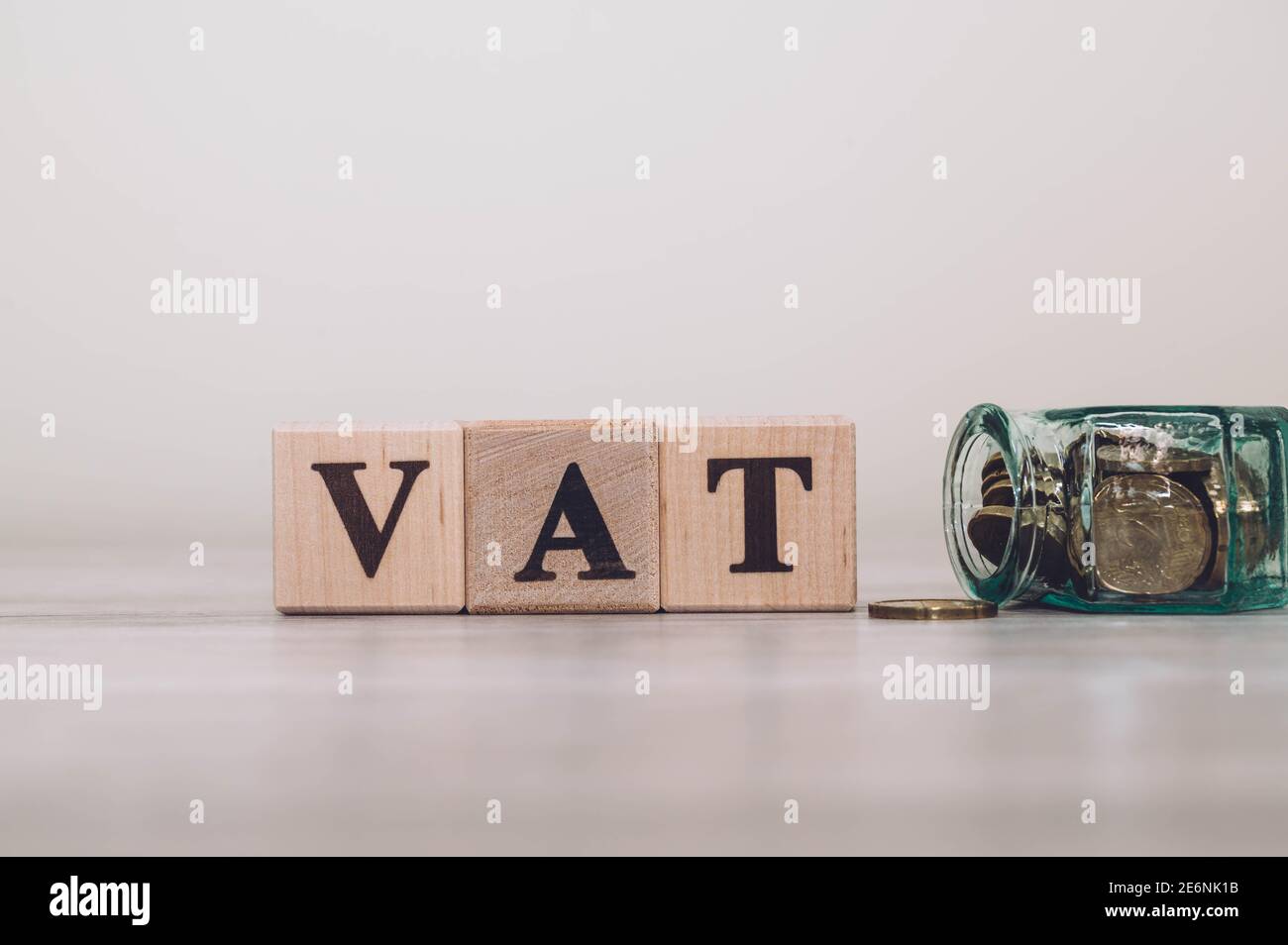 Word VAT on wooden cubes over bright background with copy space ...