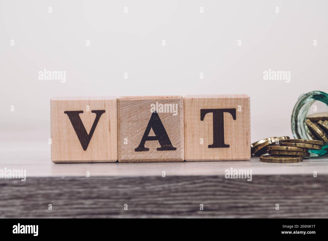 Word VAT on wooden cubes over bright background with copy space ...