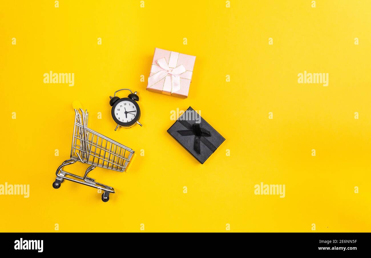 Time to gift, shopping concept, clock and christmas gift boxes on a ...