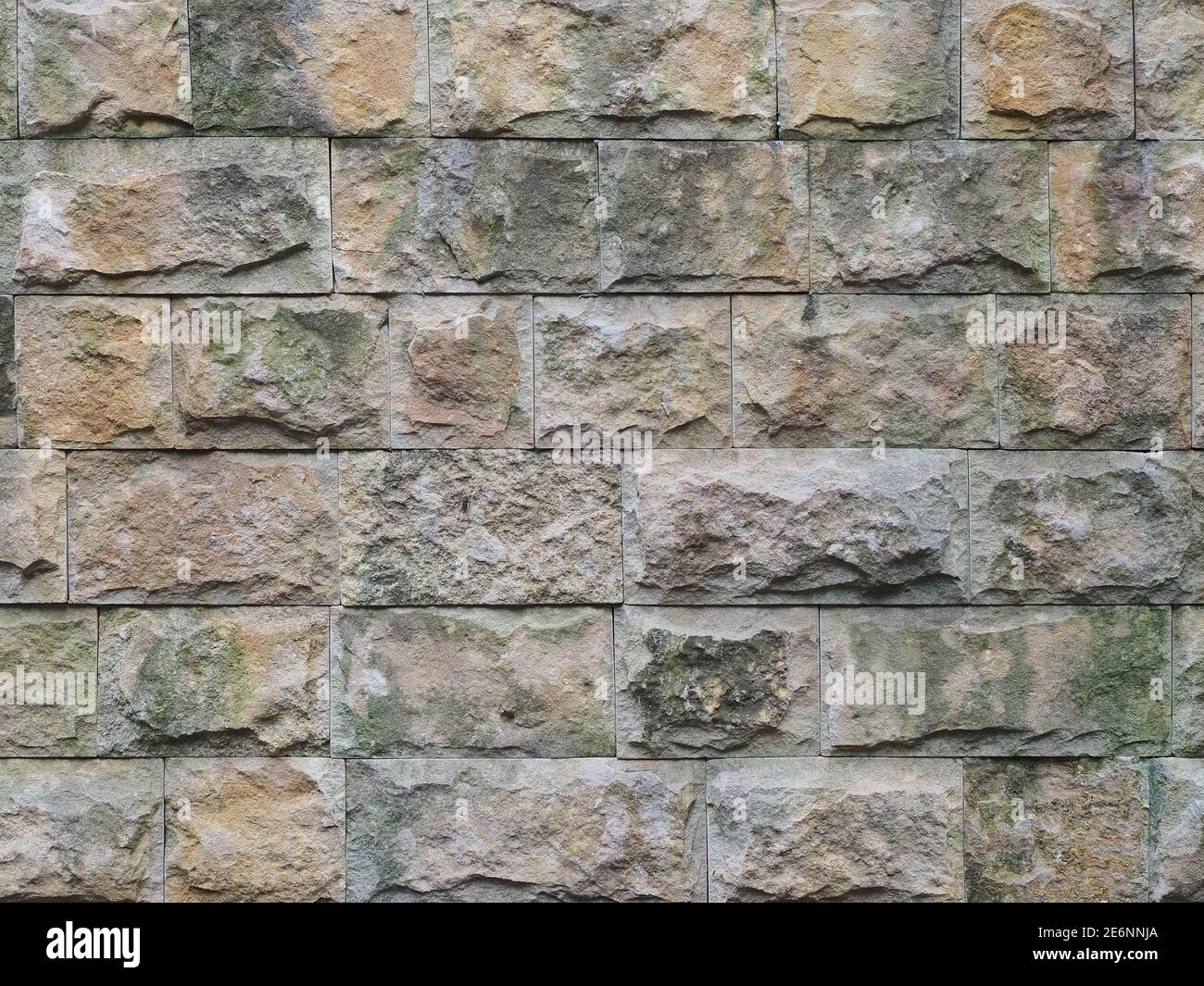 Wall with rough textured cladding of rectangular tiles. Not seamless ...