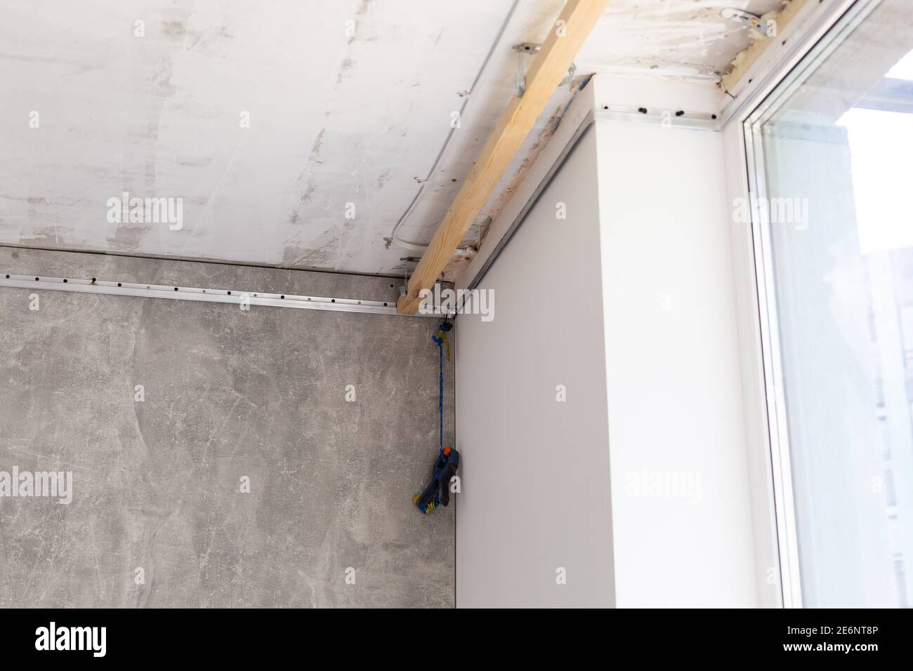 Installation of stretch ceiling. Niche for stretch ceiling. Stretch ...