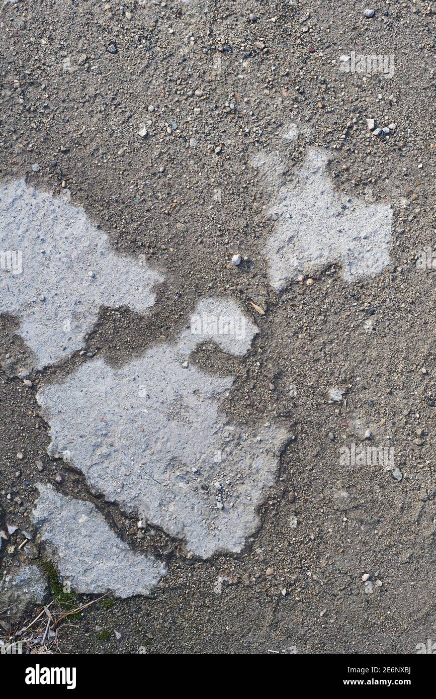 Grey texture of old broken asphalt road or wall big abrasions cracks on ...