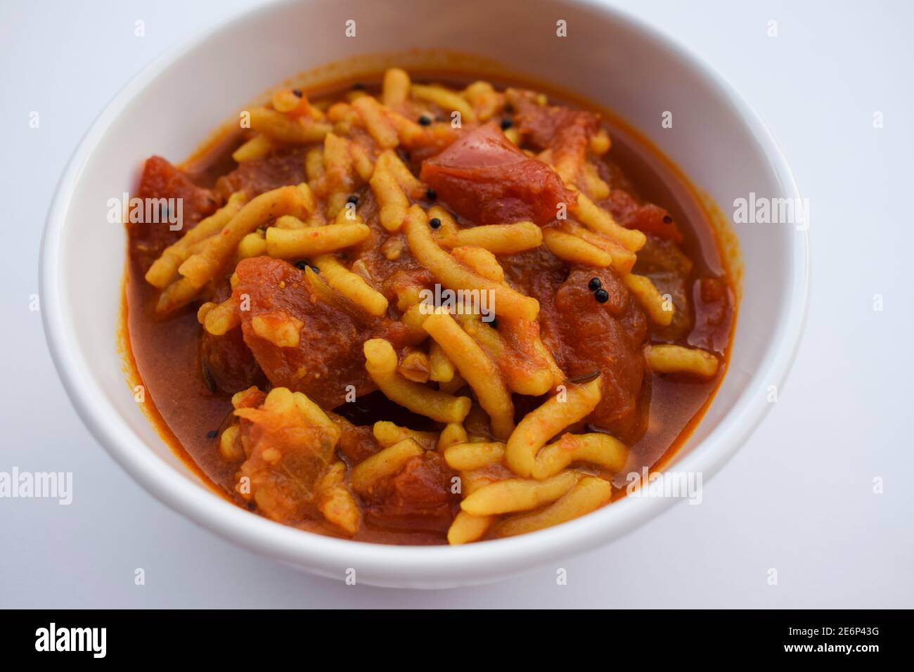 Famous and Authentic Gujarati food Sev tamatar or Sev tameta sabji made ...