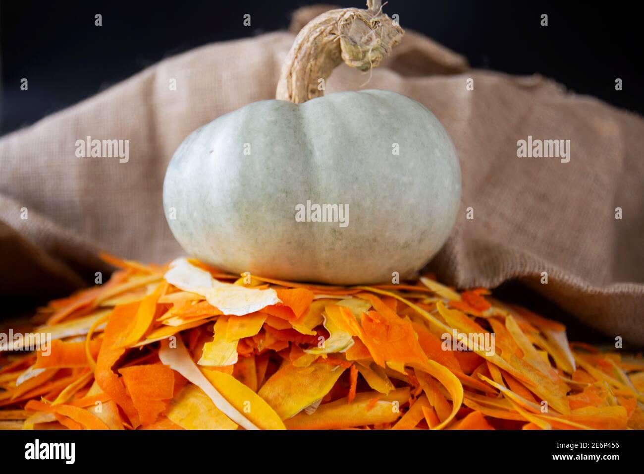 A whole fruit is cut from a peeled piece of ripe pumpkin. Horizontal ...