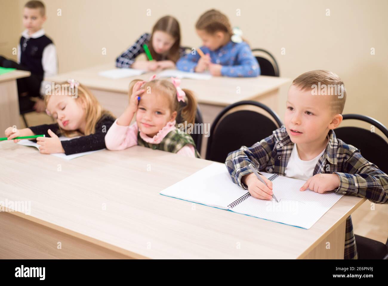 Group of elementary pupils in the classroom Stock Photo - Alamy