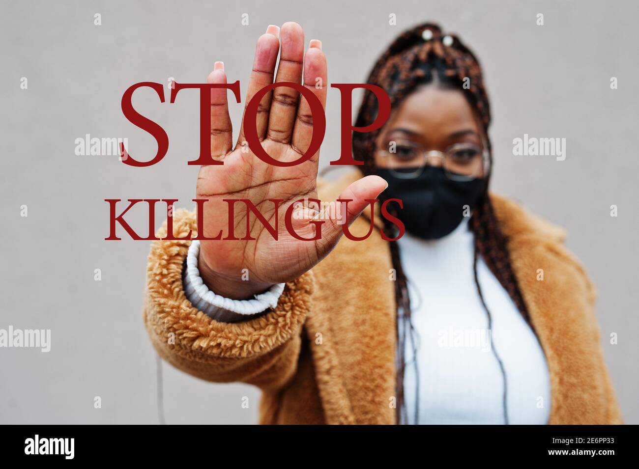 Stop killing us. African american woman, wear black face mask show stop ...