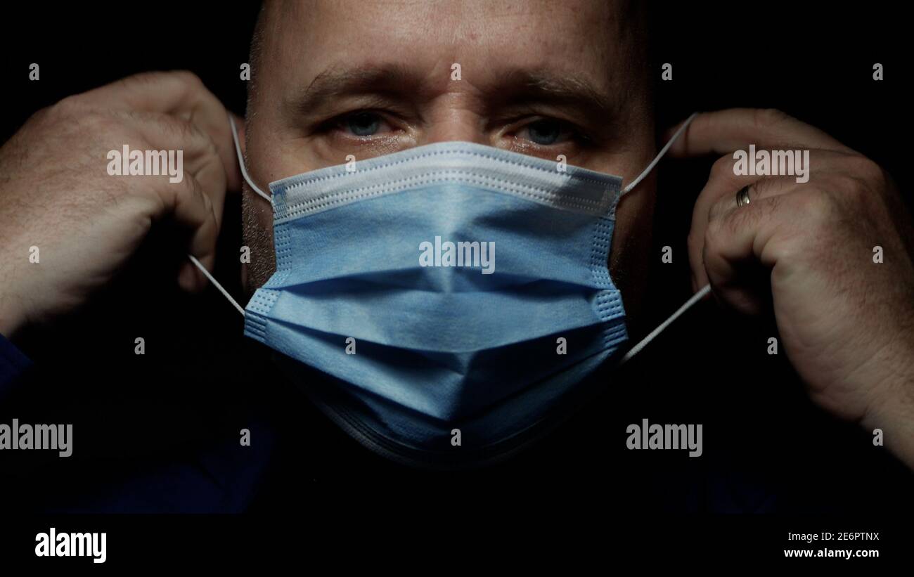 Healthcare professional wearing mask hi-res stock photography and ...