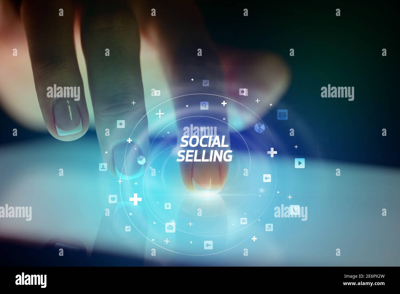 Finger touching tablet with social media icons and SOCIAL SELLING Stock ...