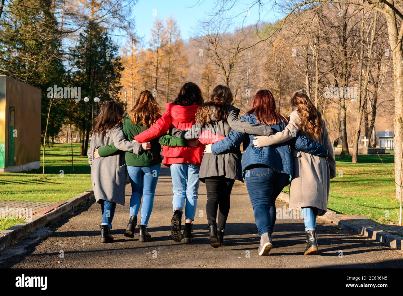 Young group of girls walking in autumn park, autumn clothes and autumn ...