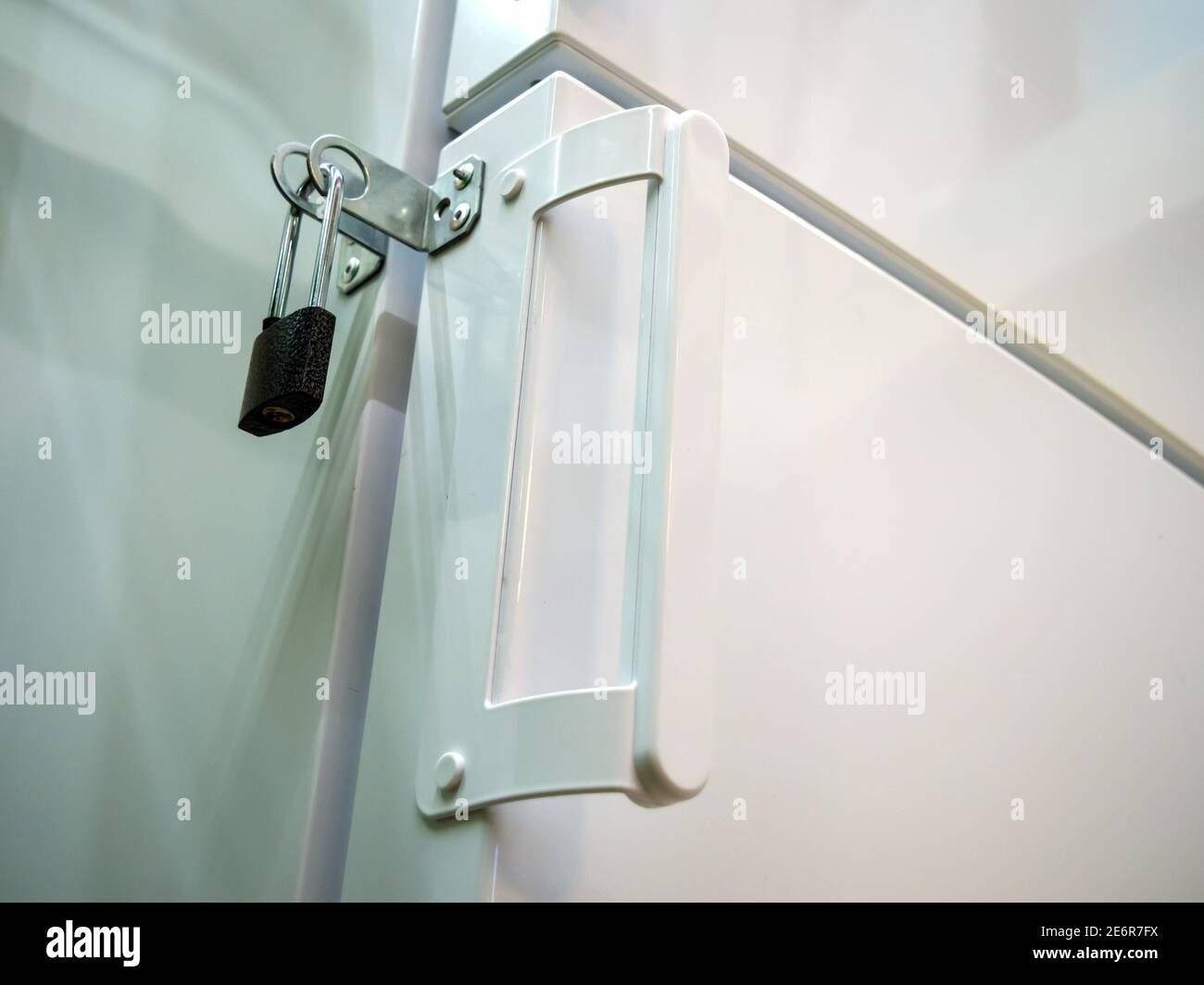 The door of the refrigerator equipped with padlocks Stock Photo - Alamy