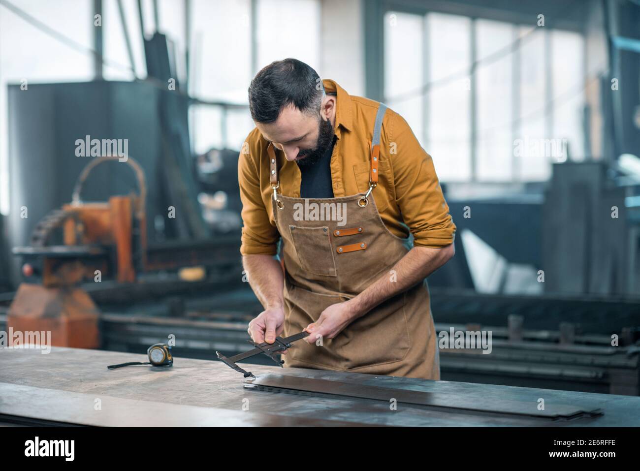 Metal industry worker at factory Stock Photo - Alamy
