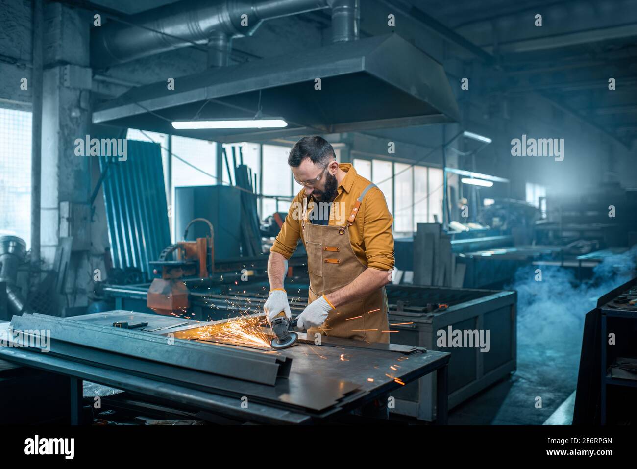Metal industry worker at factory Stock Photo - Alamy