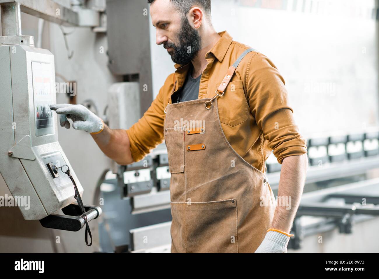Worker bending metal at the factory Stock Photo - Alamy
