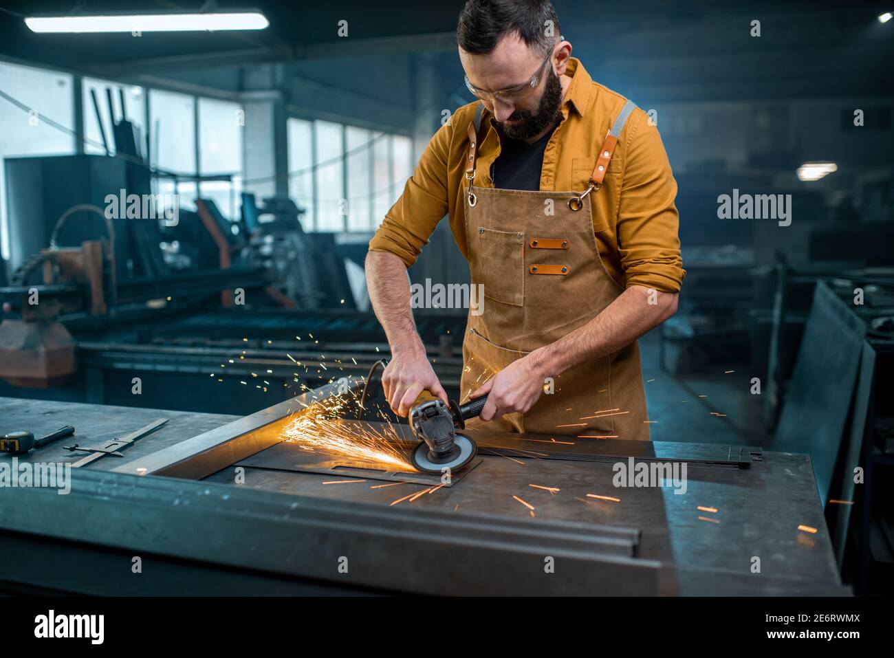 Metal industry worker at factory Stock Photo - Alamy