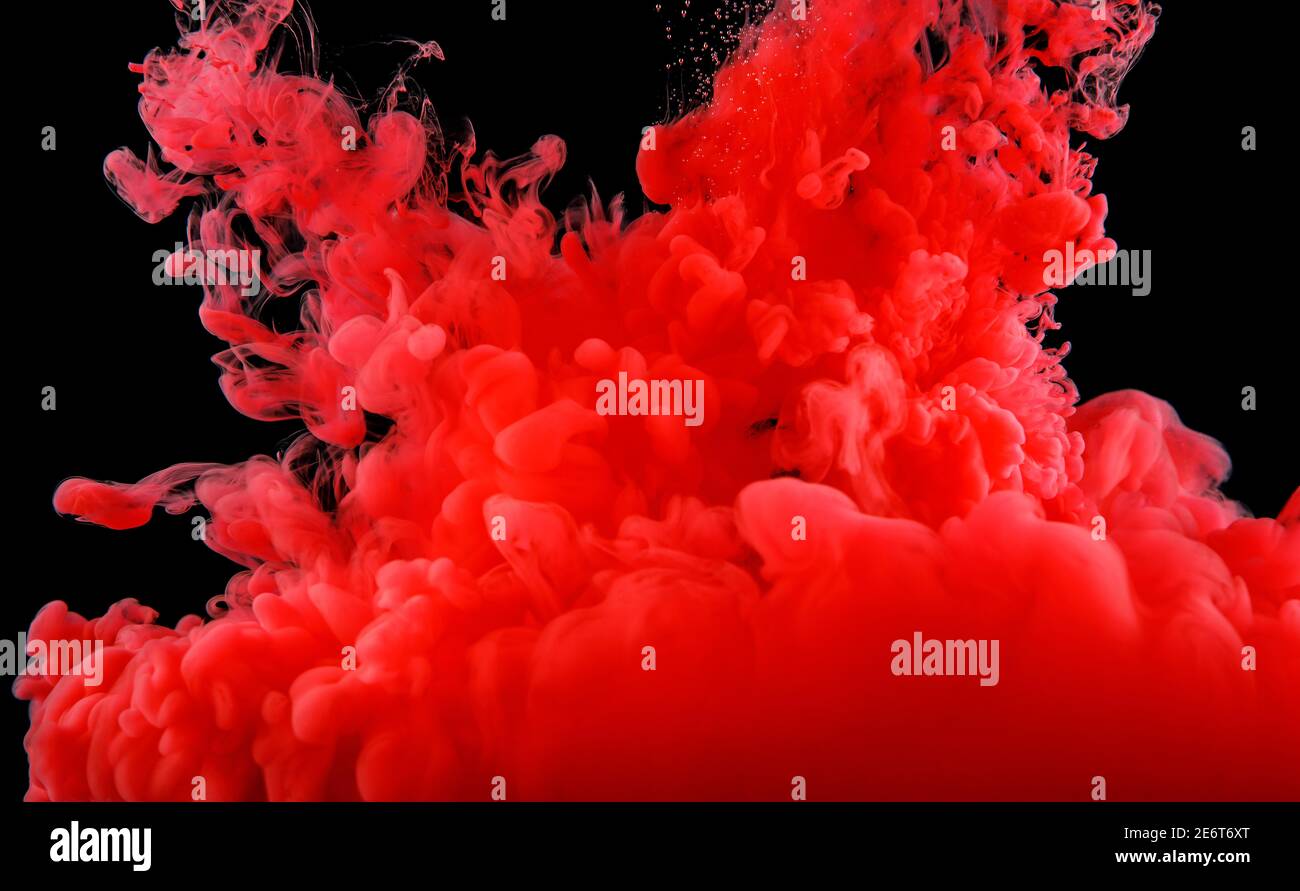 Red abstract background. Ink splashes in water on black Stock Photo - Alamy