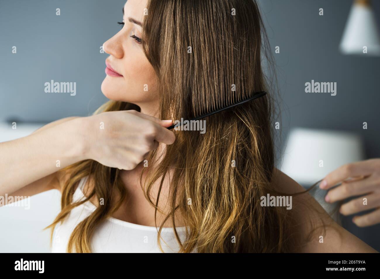 Straight hair combing hi-res stock photography and images - Alamy