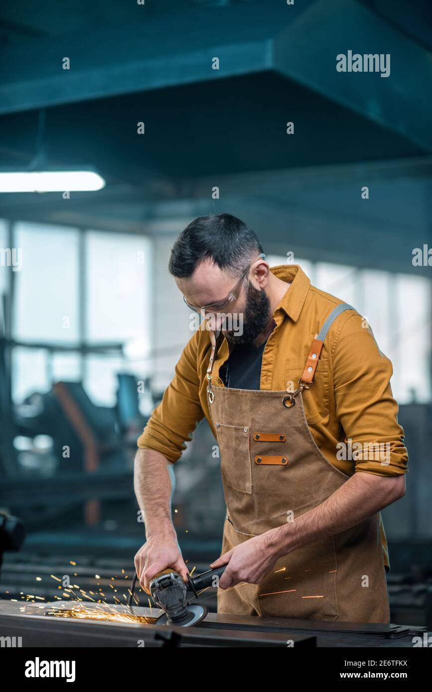 Metal industry worker at factory Stock Photo - Alamy