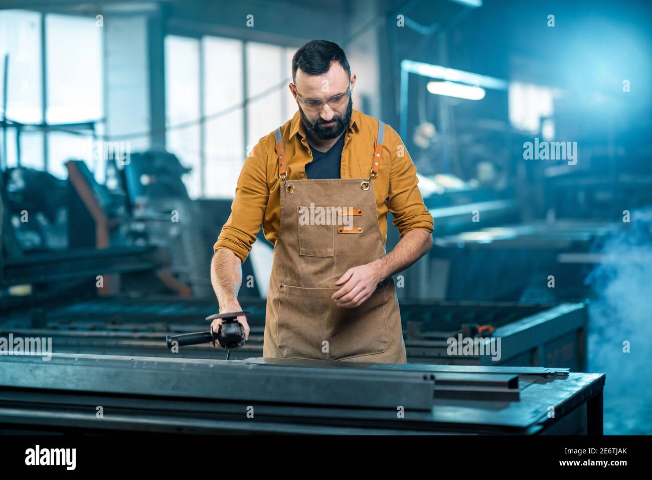 Metal industry worker at factory Stock Photo - Alamy