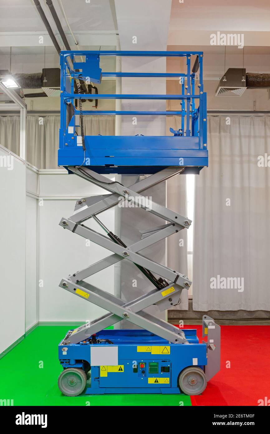Elevated Work Platform Scissor Lift Inside Building Stock Photo - Alamy