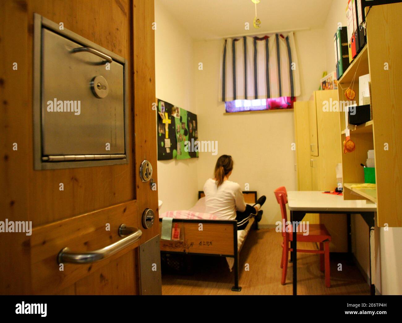 Female inmate sits in her prison cell hi-res stock photography and ...