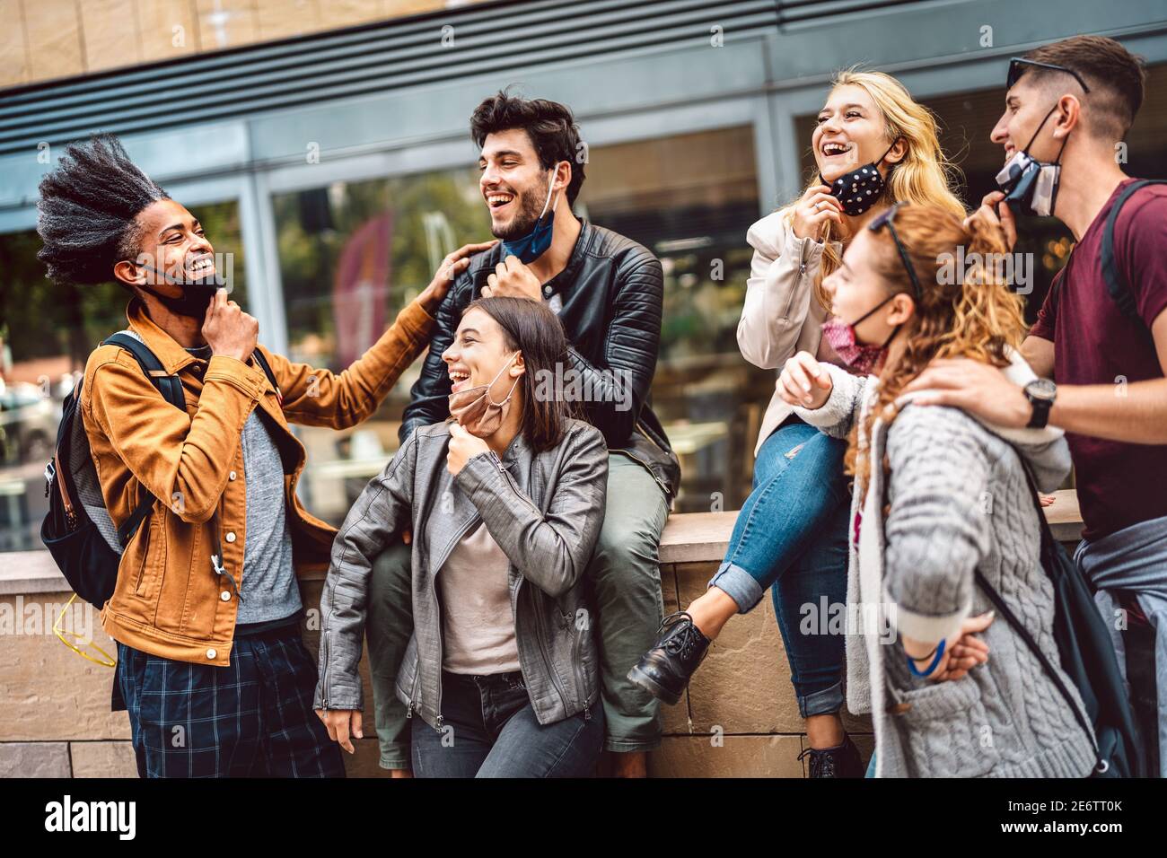 Multicultural friends having fun at city center - Happy guys and girls ...