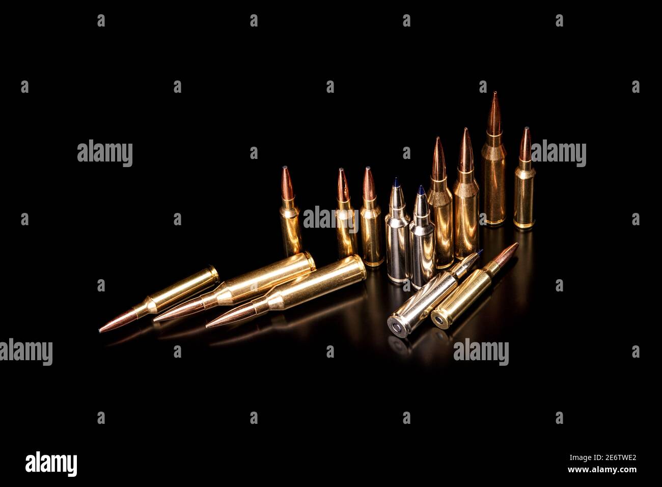 Bullet isolated on black background with reflexion. Rifle bullets close ...