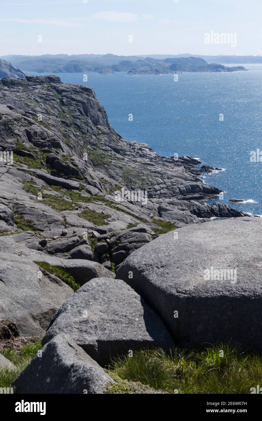 Hiking in the craggy Brufjell mountains at the coast of the North Sea ...