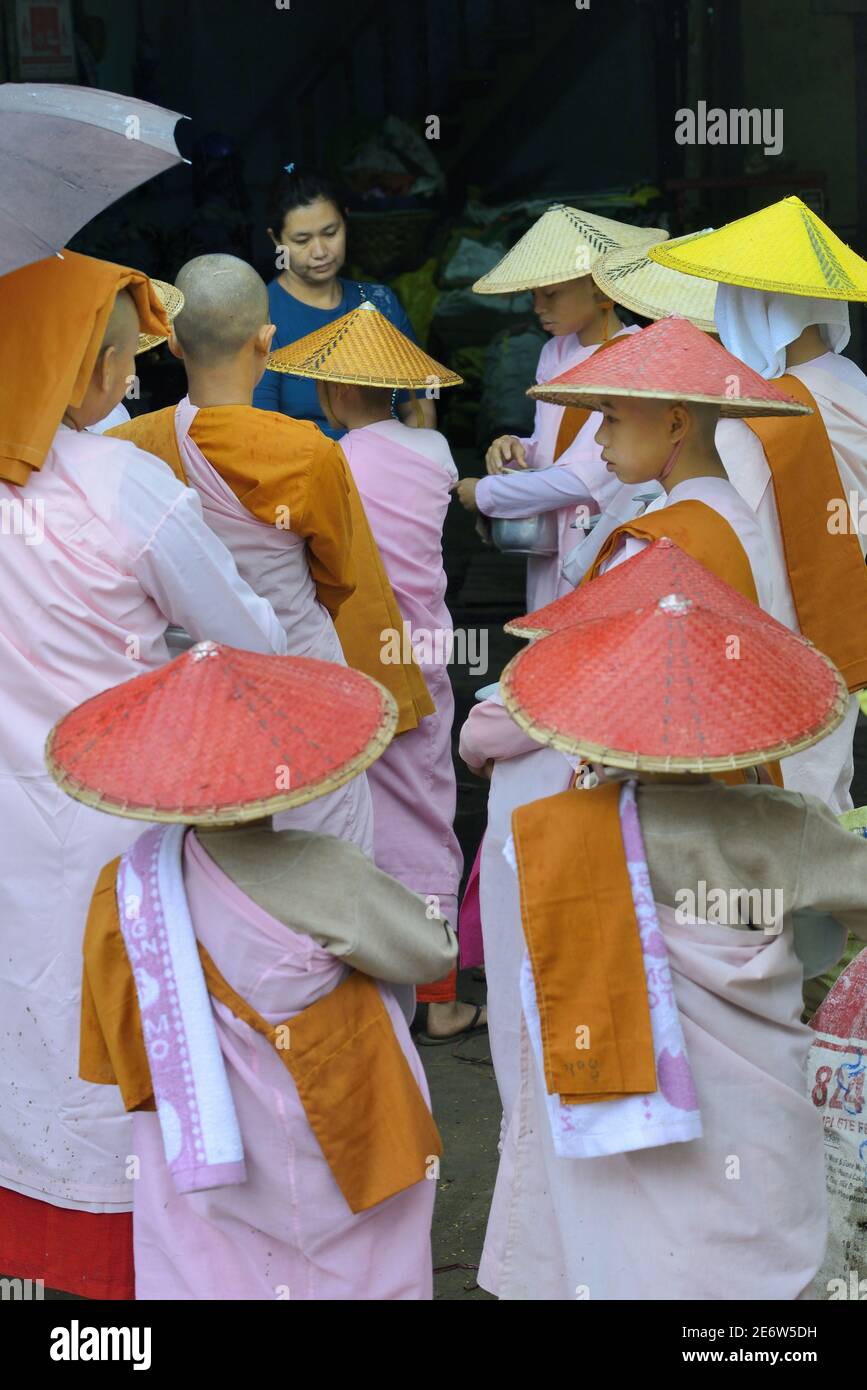 Myanmar (Burma), Mandalay, Buddhist nuns begging for alms Stock Photo ...