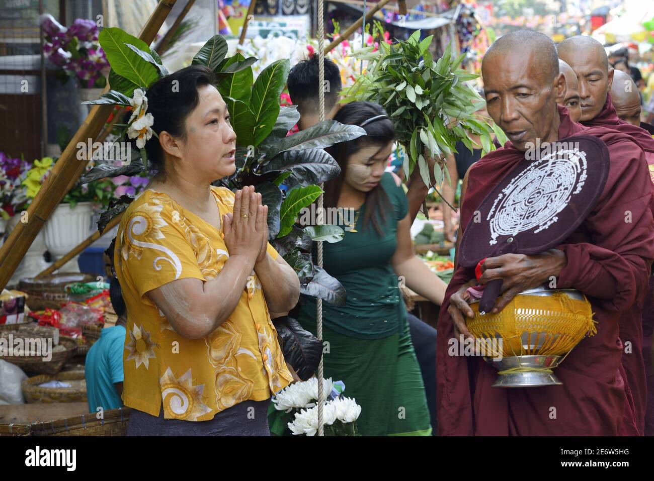 Myanmar (Burma), Yangon, Thein Gyi market, Buddhist monks begging for ...