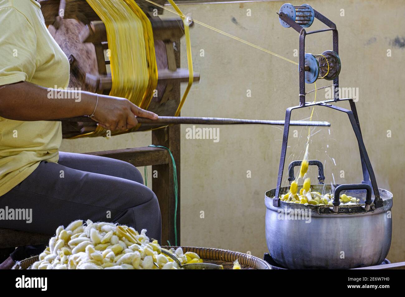 Cambodia, handicraft, silk work, extracting thread from the cocoon ...