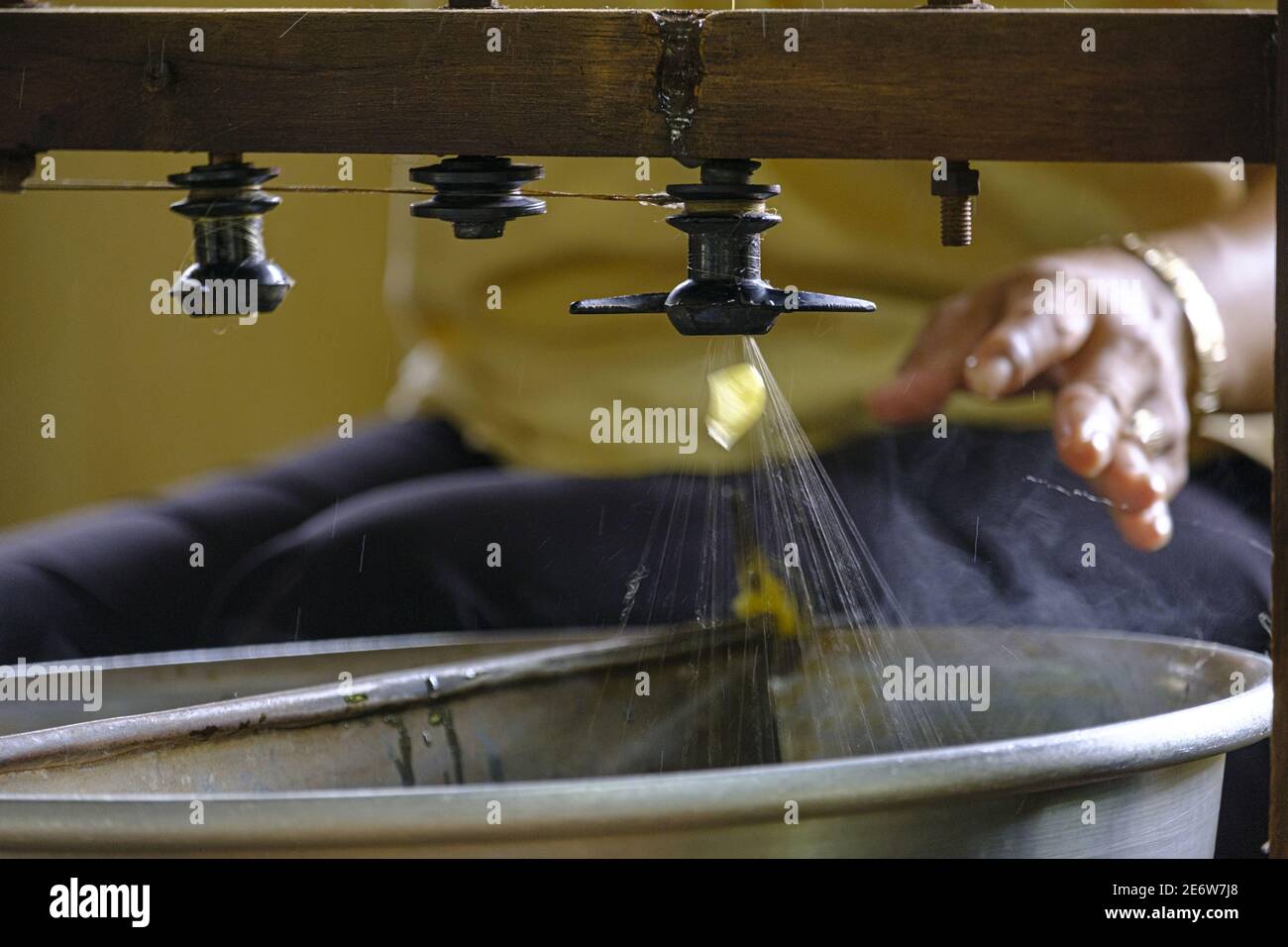 Cambodia, handicraft, silk work, extracting thread from the cocoon ...