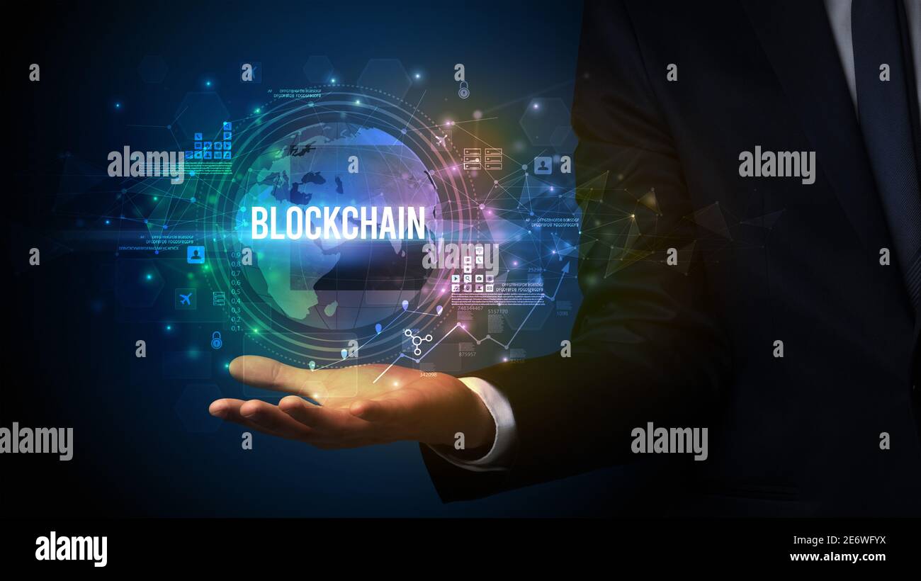 Elegant hand holding BLOCKCHAIN inscription, digital technology concept ...