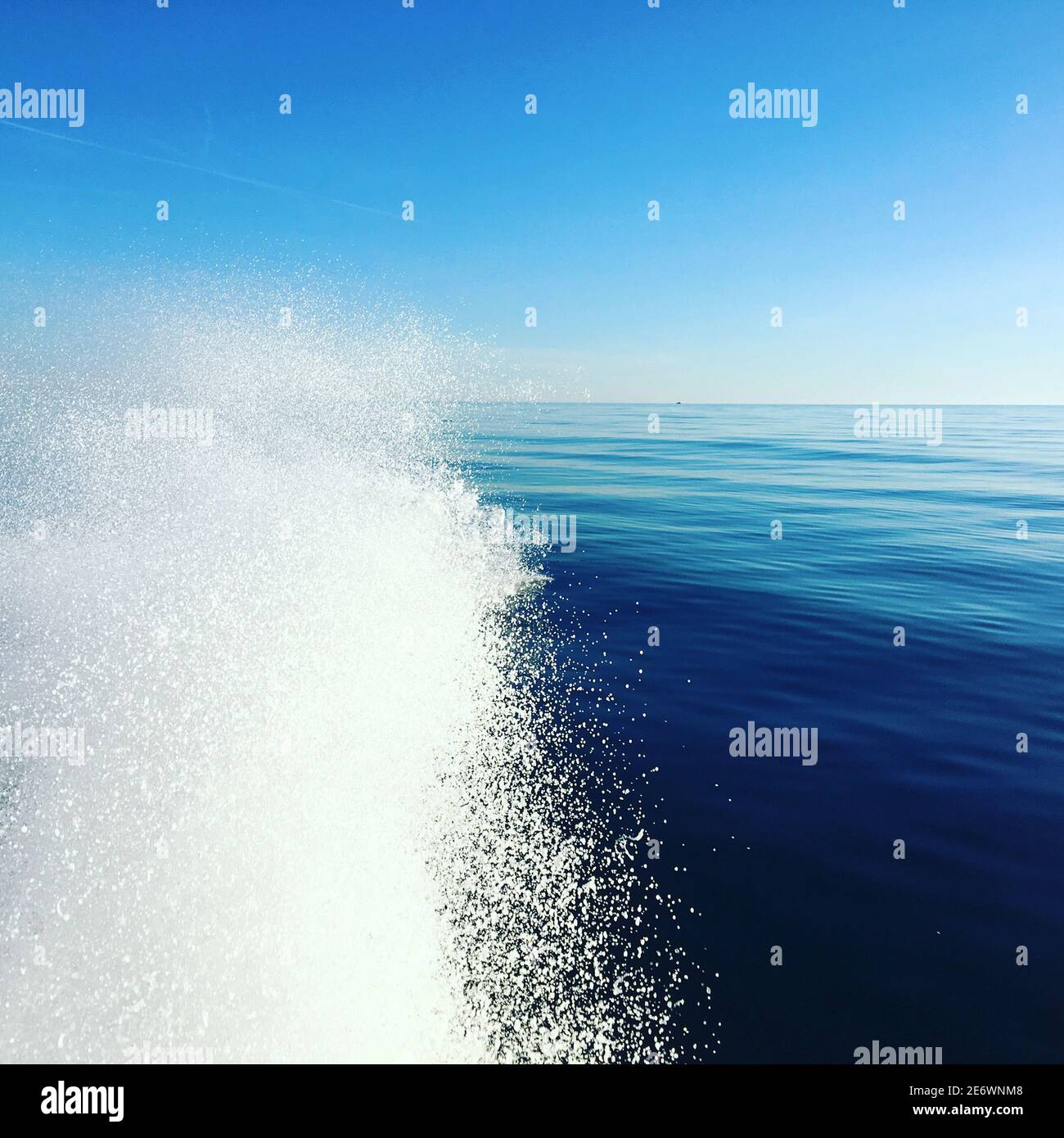 Beautiful view of splashing sea waves under the bright sky Stock Photo ...