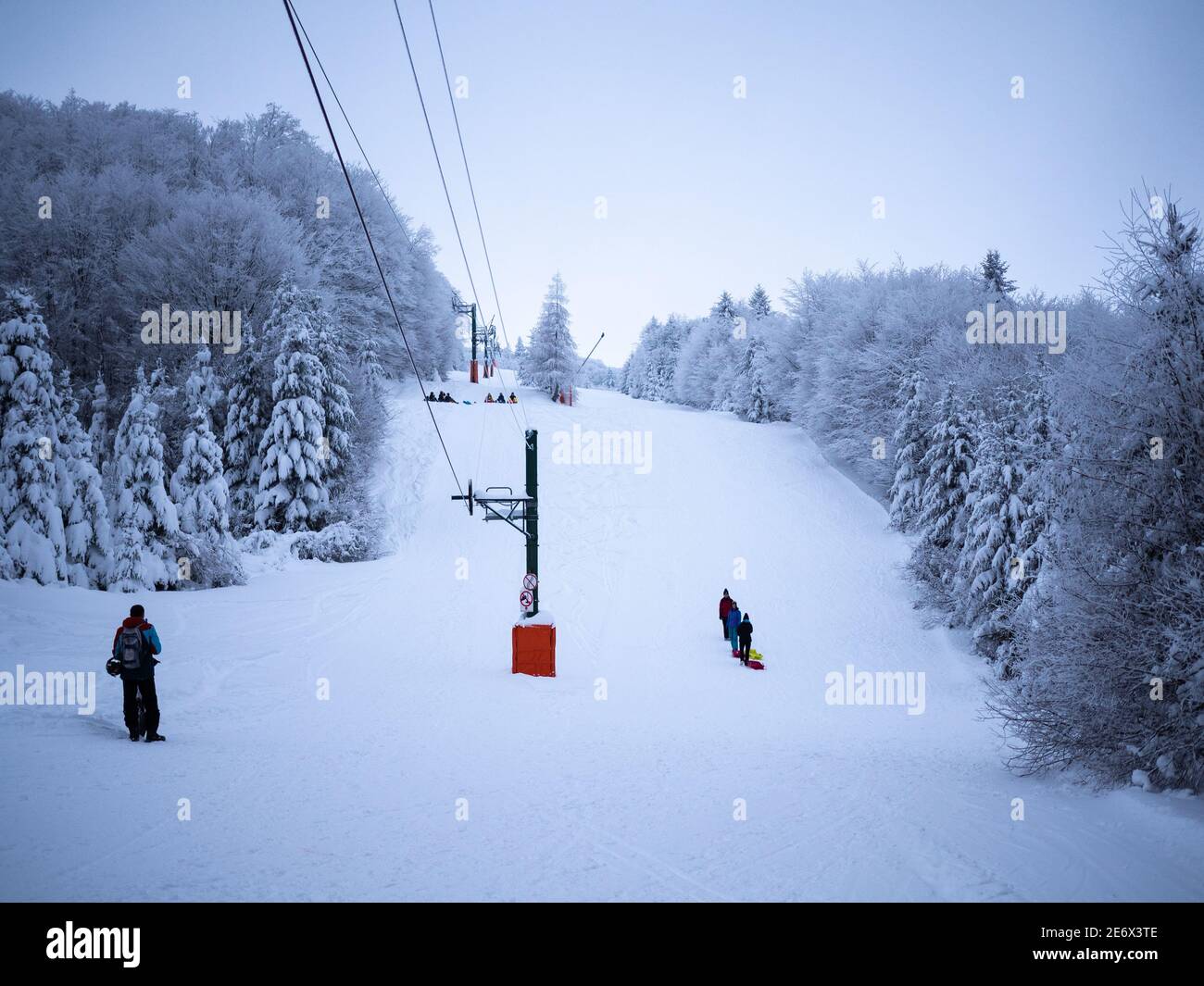 People sledging on slope hi-res stock photography and images - Alamy