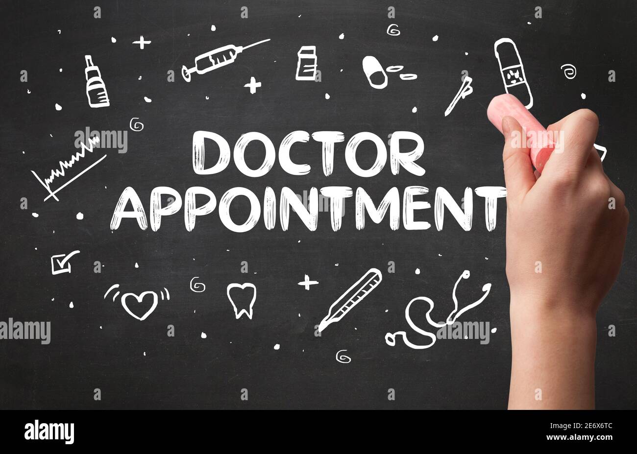 Hand drawing DOCTOR APPOINTMENT inscription with white chalk on ...