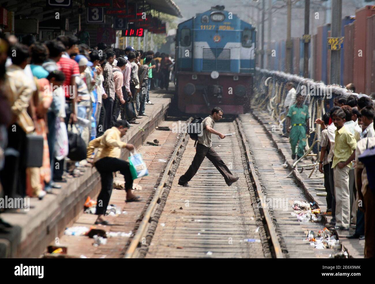 Passengers cross railway track railway hi-res stock photography and ...