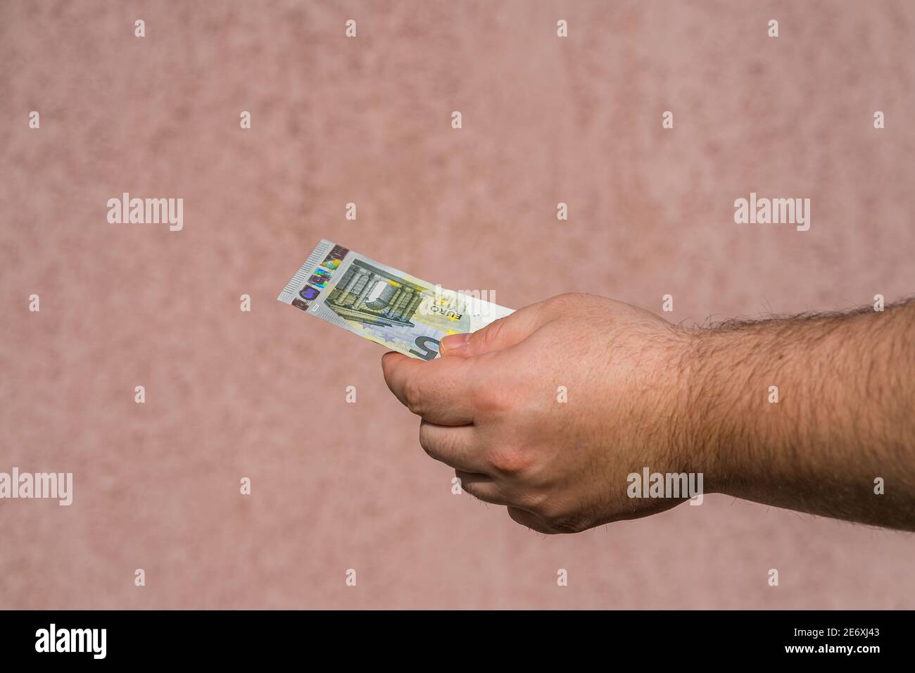 Hand holding showing euro money and giving or receiving money like tips ...