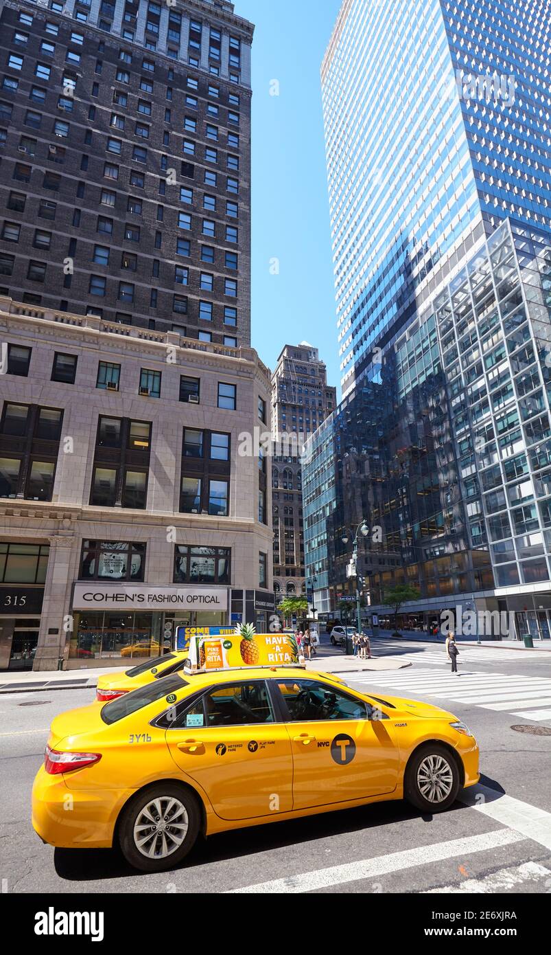 New York, USA - June 30, 2018: Yellow taxicab on a street of Midtown ...