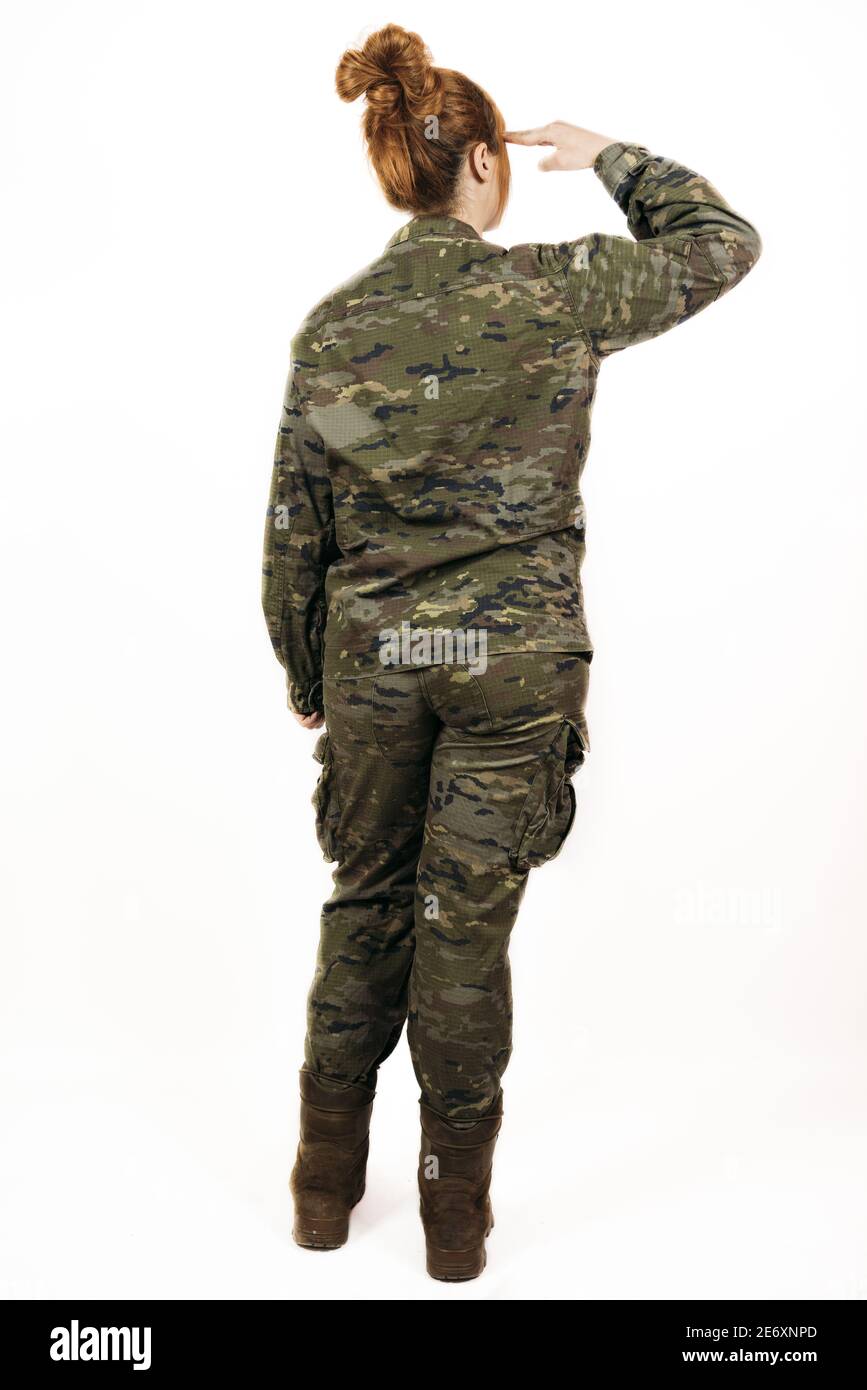 Back view of a woman wearing military uniform giving a military hand ...
