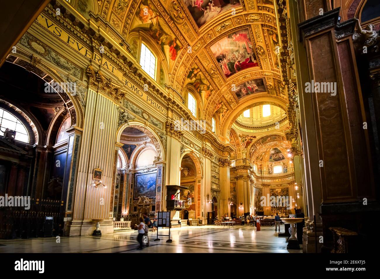 The ornate, baroque interior of the Basilica of Sant'Andrea della Valle ...