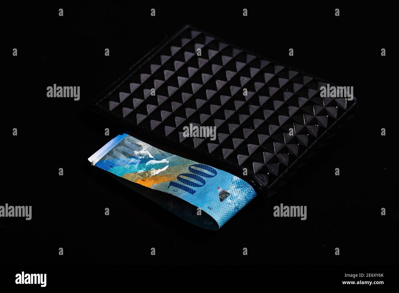 100 swiss franc banknote in a black wallet isolated Stock Photo - Alamy