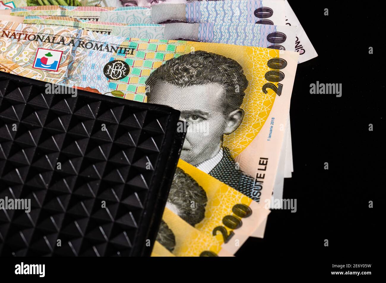 LEI romanian money banknotes in black wallet isolated Stock Photo - Alamy