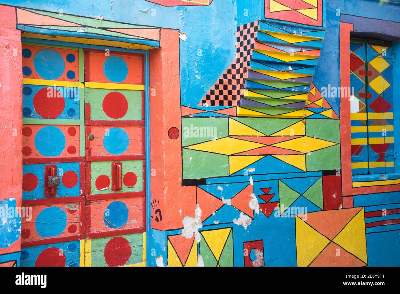 Anonymous wall in a narrow street on the island of Burano, Venice, with ...