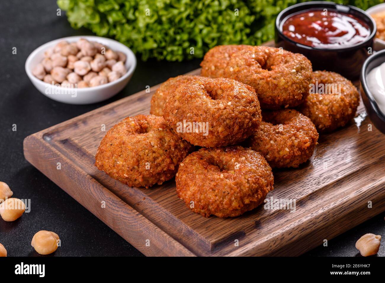 Beautiful delicious fresh chickpea falafel with sauces on a concrete ...